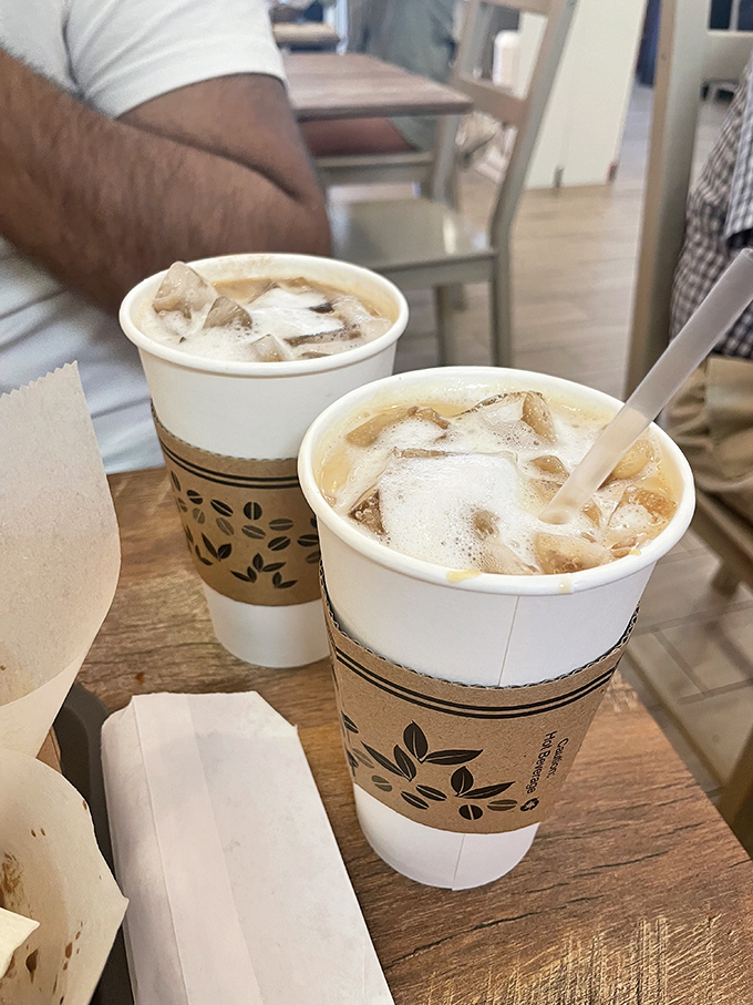 Iced coffee companions waiting for their moment in the spotlight. In Florida heat, these aren't just drinks – they're survival tools.