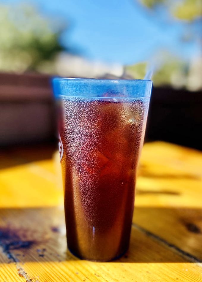 In Florida heat, this sweating glass of sweet tea isn't just a beverage—it's survival equipment disguised as a refreshing southern tradition.