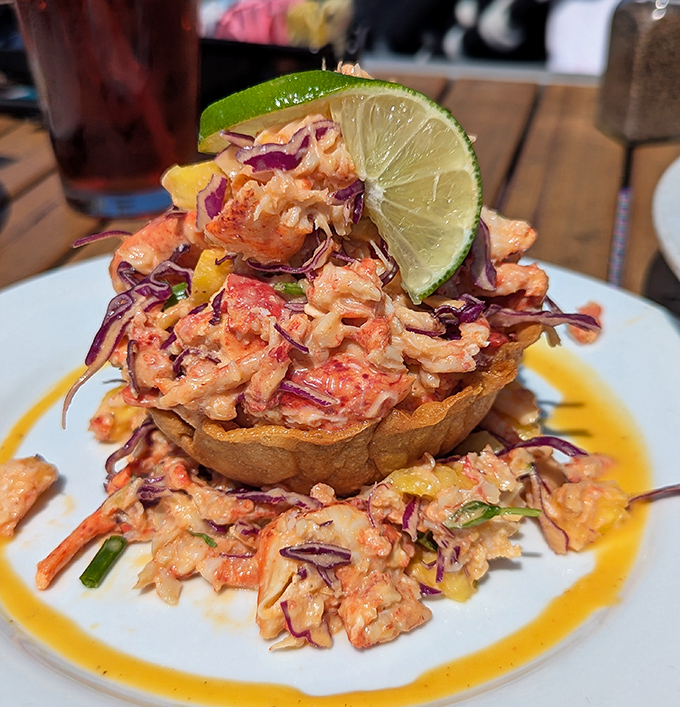 A tower of lobster that's dressed better for summer than most beachgoers. That lime wedge isn't just garnish—it's the exclamation point.