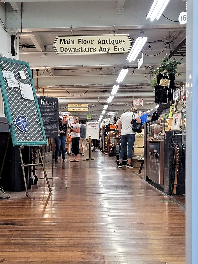 The marketplace's "Main Floor Antiques" sign might as well read "Enter At Risk Of Joyful Distraction" for unsuspecting visitors.