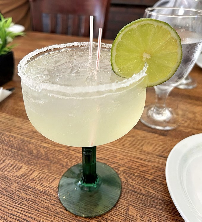 A proper margarita with salt-rimmed sophistication – the perfect cooling companion to the rich, pressed sandwiches.