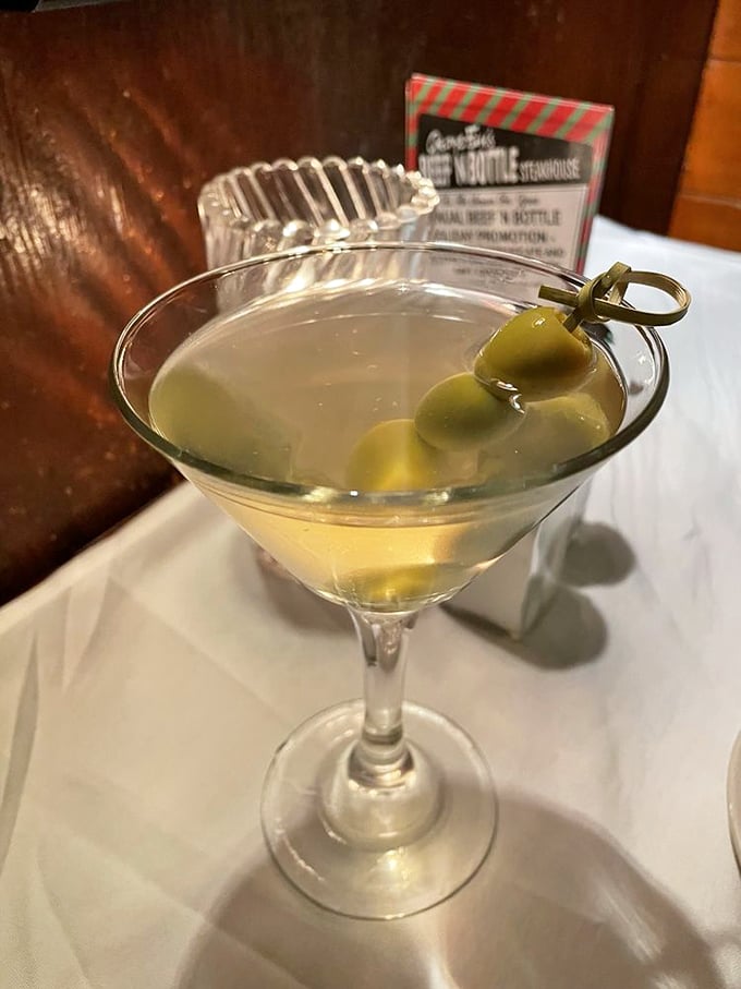 The classic martini—three olives standing at attention like tiny soldiers guarding the gateway to a perfectly civilized evening.
