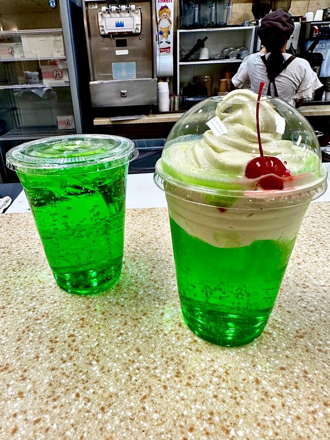 Melon soda floats—electric green nostalgia in a cup. Like drinking a Jolly Rancher that went to finishing school.