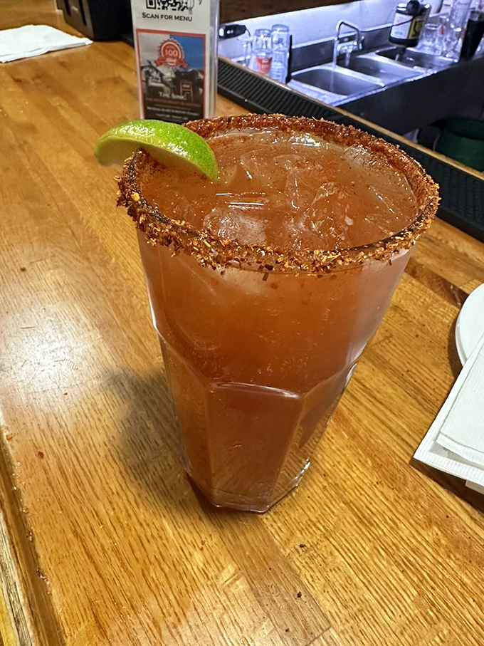 The Michelada—a spicy, tangy revelation rimmed with chile salt that makes regular drinks seem like they're not even trying.