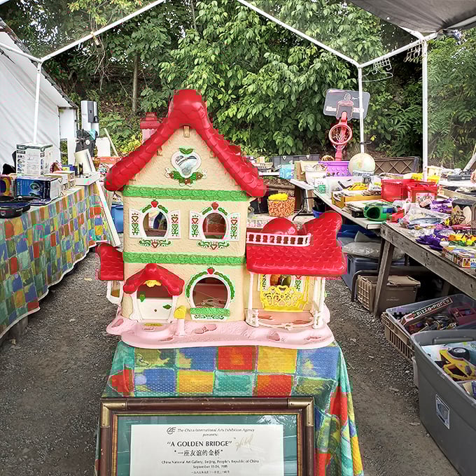 Childhood nostalgia in miniature form. This dollhouse awaits a new generation of imaginative play—or perhaps an adult collector's cherished display shelf.