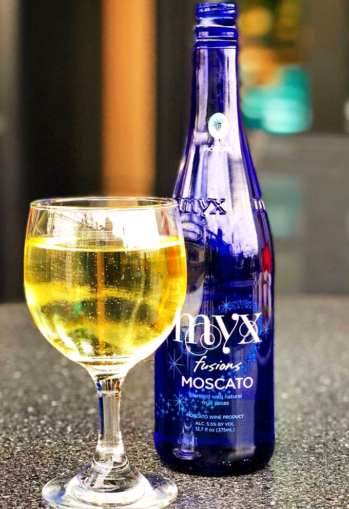 Liquid sunshine in a blue bottle. The Moscato offers a sweet counterpoint to the savory deli fare – because sometimes adults need a juice box too.