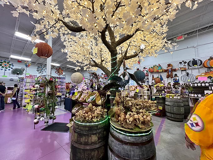 This illuminated cherry blossom tree creates a magical centerpiece amid barrels of treasures. Nature meets artistry in this Instagram-worthy display.