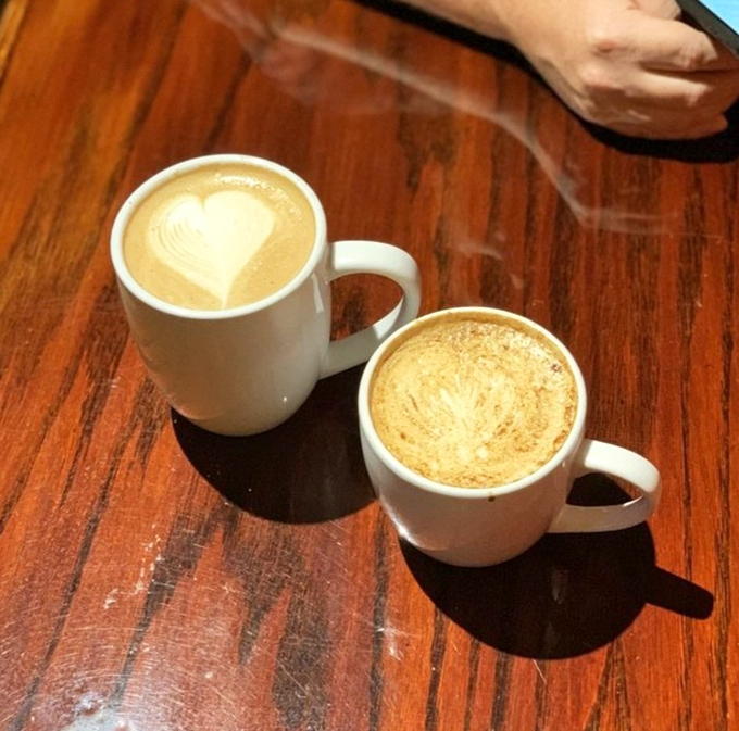 Coffee art that's too pretty to drink—almost. These lattes aren't just beverages; they're warm, caffeinated hugs in matching mugs.