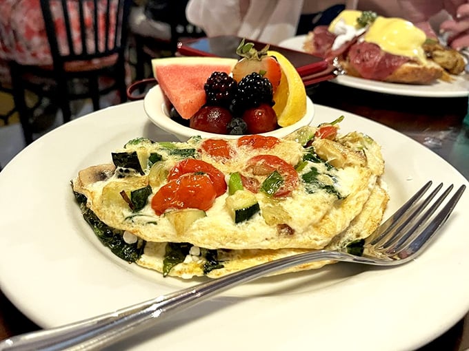 A veggie omelet that could convert carnivores, paired with fresh salsa that brings just enough zing to wake up your taste buds without alarming them.