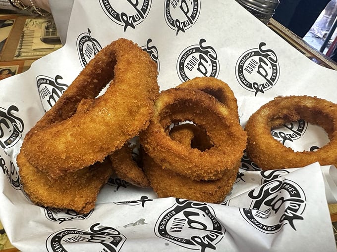 These aren't just onion rings—they're golden halos of happiness, crispy enough to make angels weep with deep-fried joy.