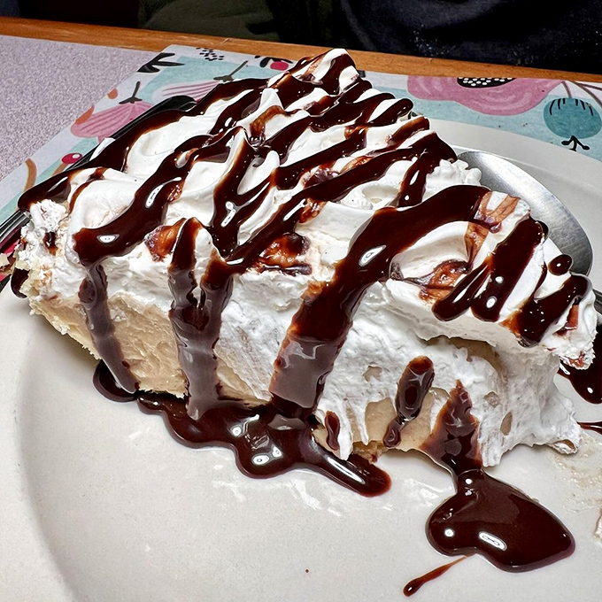 A slice of heaven with chocolate drizzle—because after conquering a mountain of fried chicken, you deserve a sweet victory lap.