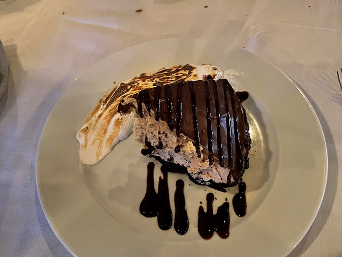 Dessert that makes you pause mid-conversation—layers of chocolate decadence with artistic sauce drizzles that would make Jackson Pollock proud.