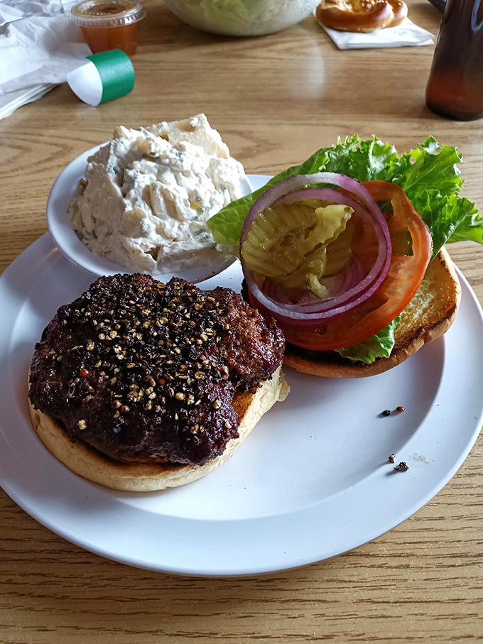 This burger isn't just seasoned—it's experienced. The sesame-studded patty and garden-fresh toppings create the perfect handheld symphony.
