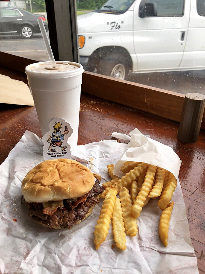 The classic American trinity: burger, fries, and soda – proof that happiness doesn't need to be complicated, just perfectly executed.
