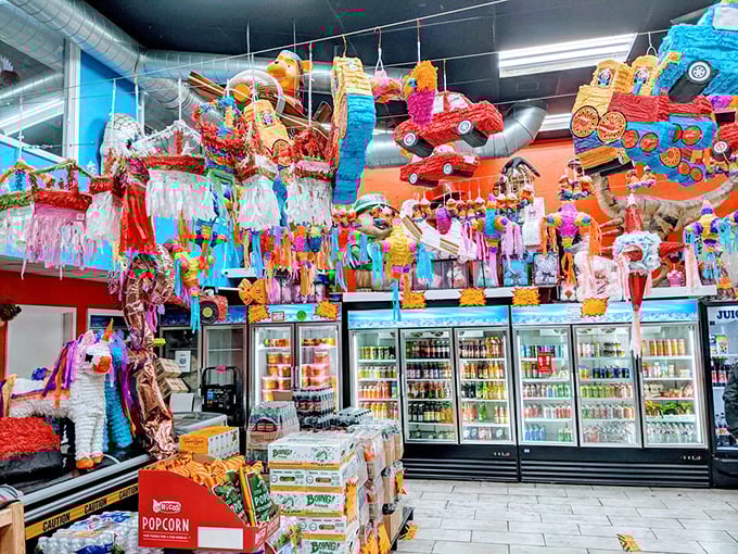Colorful piñatas dangle from the ceiling like sugary constellations, promising both decoration and the ultimate candy delivery system.