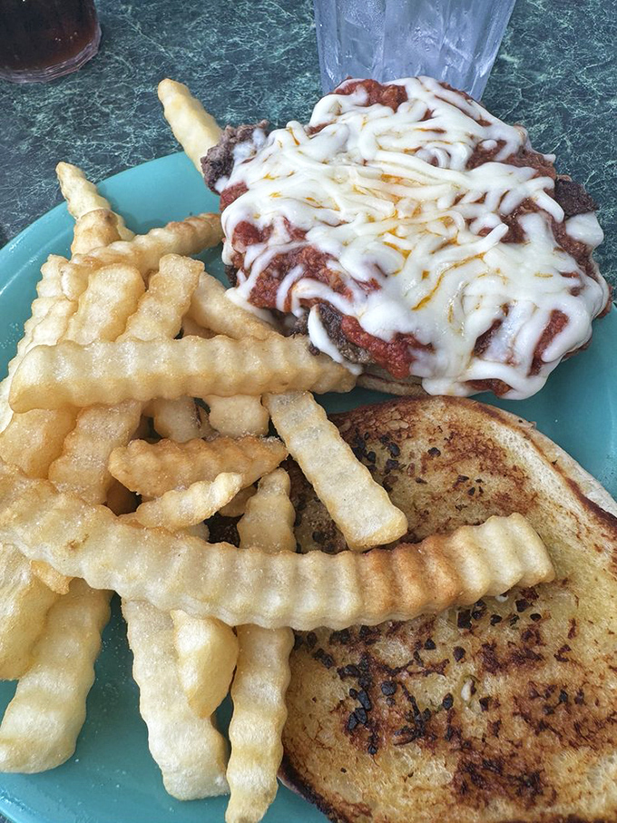This isn't just a sandwich—it's an architectural marvel of melted cheese, crispy fries, and toasted bread that demands both respect and napkins.