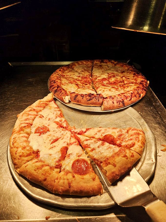 Pizza that would make an Italian grandmother nod in approval—golden cheese bubbled to perfection atop a crust that strikes the ideal balance of chewy and crisp.