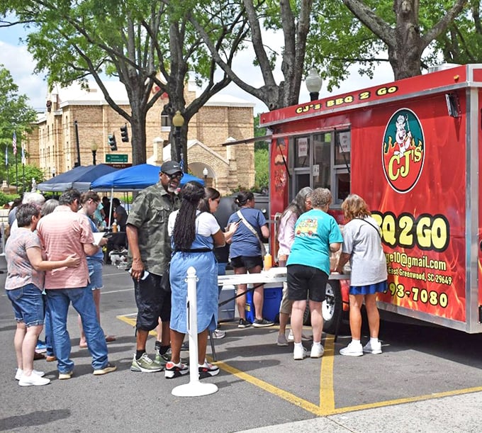 Nothing says "community" like a food truck gathering where strangers become friends over shared tables and the universal language of "mmm, try this!"