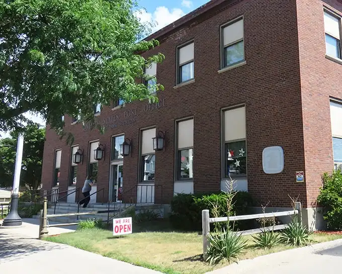 The East Tawas Post Office stands as a brick testament to civic architecture. Mail delivery: bringing communities together since forever.