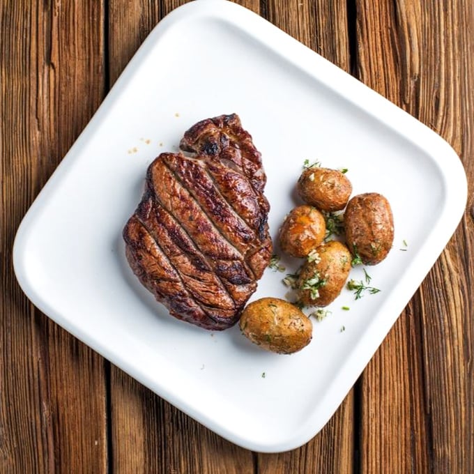 A steak so perfectly seared it deserves its own Instagram account. Those roasted potatoes aren't just sidekicks—they're scene-stealers.