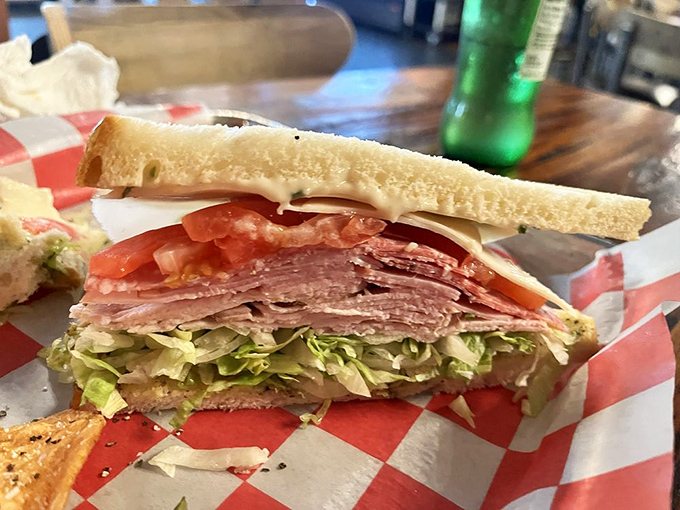 Fresh ingredients stacked with precision – this sandwich isn't just assembled, it's composed, like a delicious edible symphony on whole grain bread.