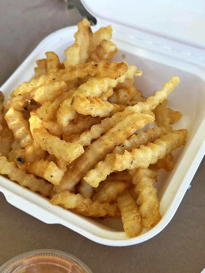 These aren't just any fries—they're Sassy Fries, cooked in beef tallow like the fast food gods intended before the 1990s health craze ruined everything.