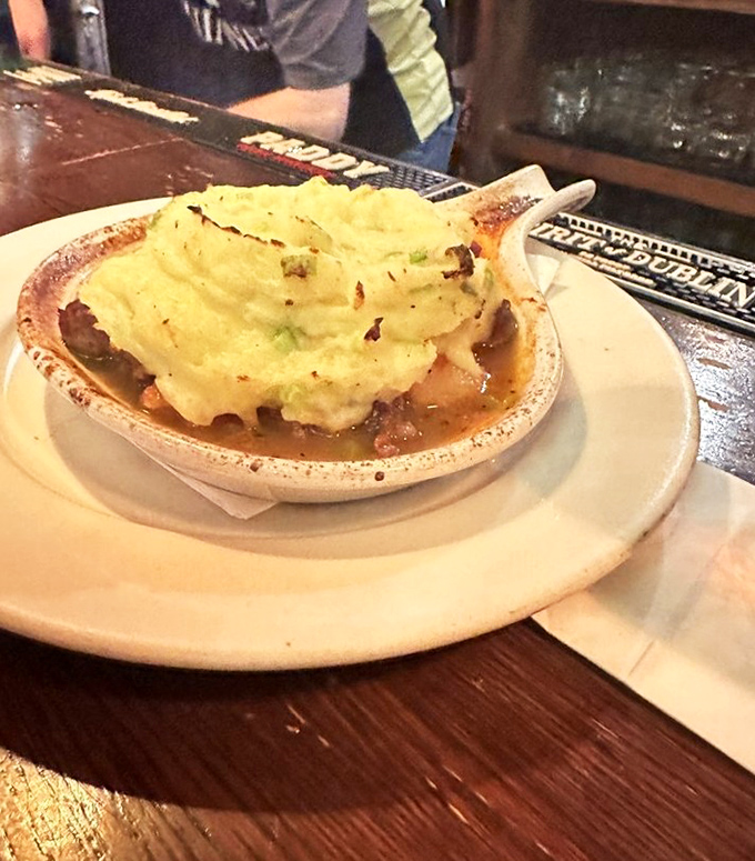 Not just shepherd's pie—it's a savory lullaby under a cloud of mashed potatoes that's been kissed by fire until golden and irresistible.