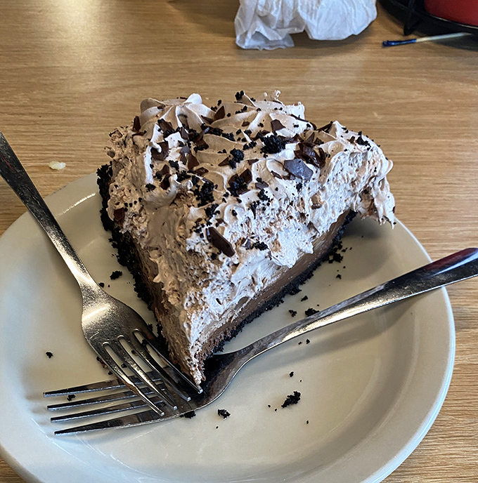Dessert isn't an afterthought here—this chocolate cream pie with its cloud of whipped topping proves they take your sweet tooth as seriously as your appetite.