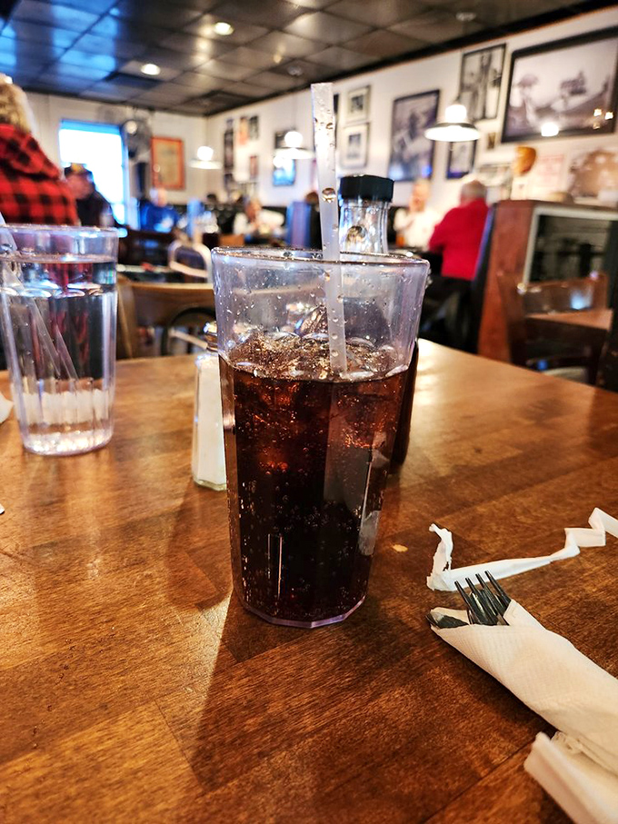 That classic diner soda in a plastic tumbler—where the ice-to-soda ratio is always perfect and refills appear like magic.