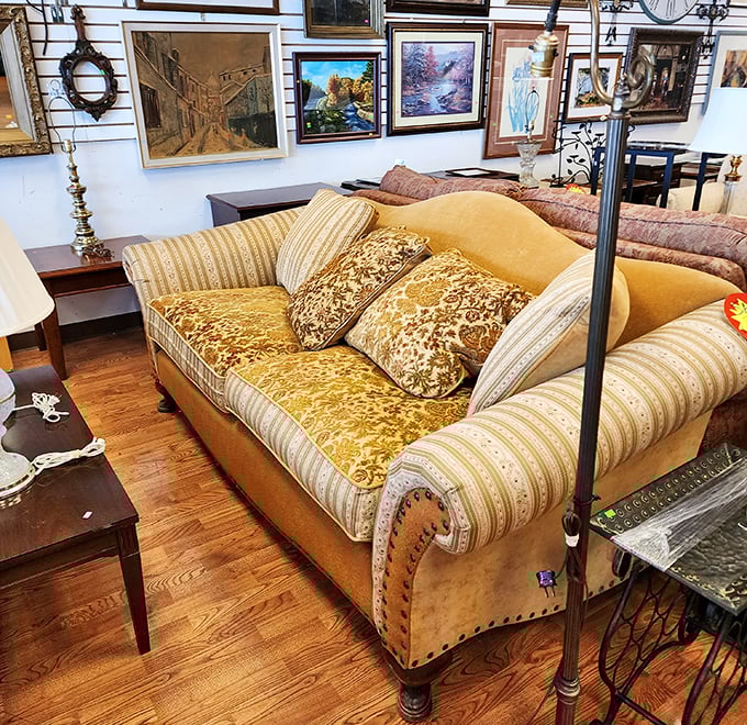 That sofa has seen some living—and is ready for more. With its golden hues and vintage charm, it's practically begging for a Netflix marathon.