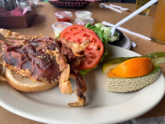 The soft shell crab sandwich—where eating the entire crustacean, shell and all, somehow becomes the most civilized thing you'll do all day.