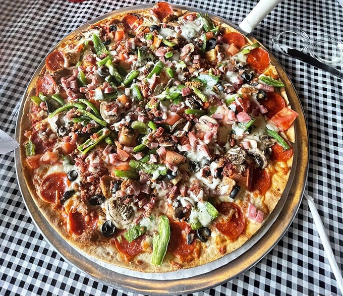When a pizza carries this many toppings, it's not just dinner—it's a commitment to excellence and possibly a delightful food coma.