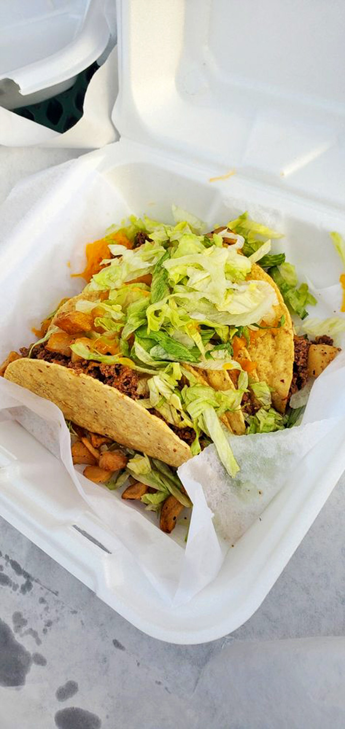 These aren't just tacos; they're edible architecture—crisp shells supporting the perfect ratio of meat, cheese, and fresh lettuce.