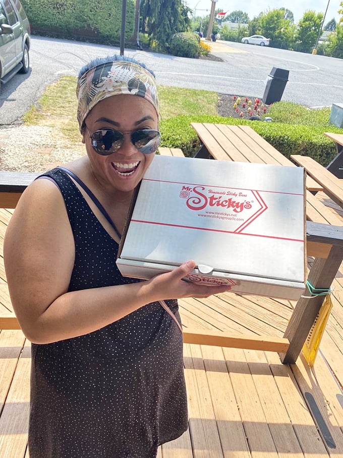 That smile says it all—the universal expression of "I've scored the motherlode of sticky buns." Pure, unadulterated joy. 