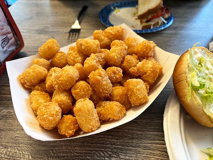These golden tater tots aren't just nostalgic school lunch flashbacks—they're perfectly crisp potato nuggets elevated to proper culinary respect.