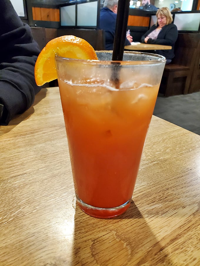 This Tequila Sunrise isn't just a cocktail—it's liquid sunshine in a glass, the perfect companion to walleye and good conversation.