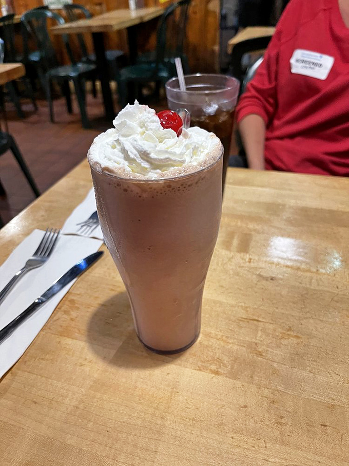 The Candy Man Frappe isn't just a milkshake—it's a dessert skyscraper topped with enough whipped cream to make a dairy farmer blush.
