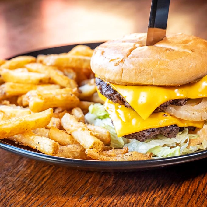 The Ranger Burger stands tall and proud—a skyscraper of beef, cheese, and fresh toppings that makes fast food chains weep with inadequacy.