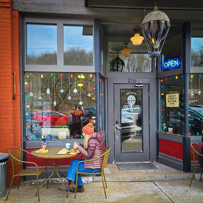 TipTop Coffee Bar welcomes visitors with colorful lights and outdoor seating—the kind of place where one cup turns into three hours of conversation.