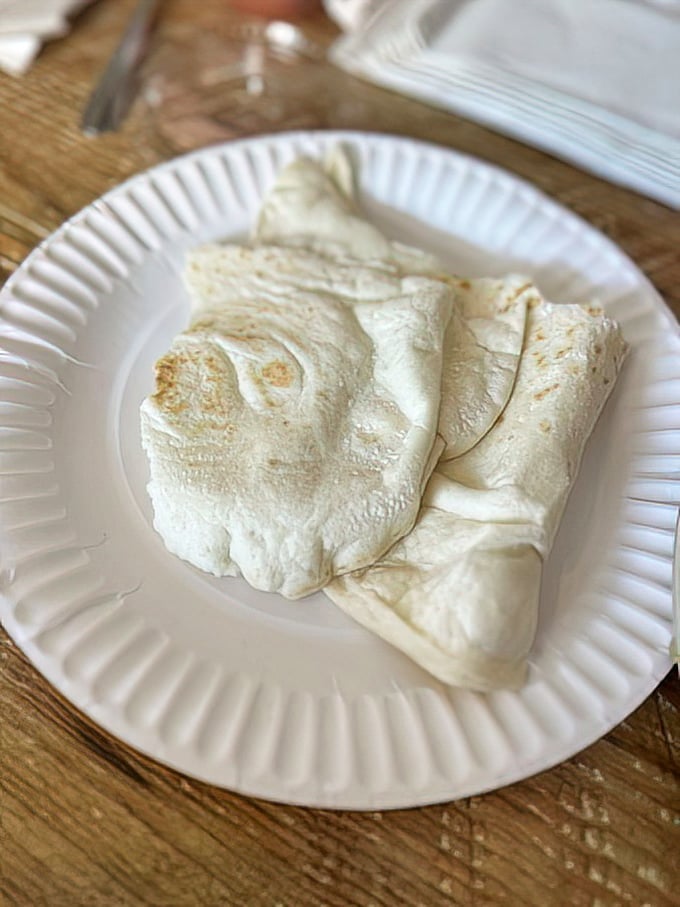 A tortilla so fresh and perfectly folded, it could teach origami masters a thing or two about the art of containment.