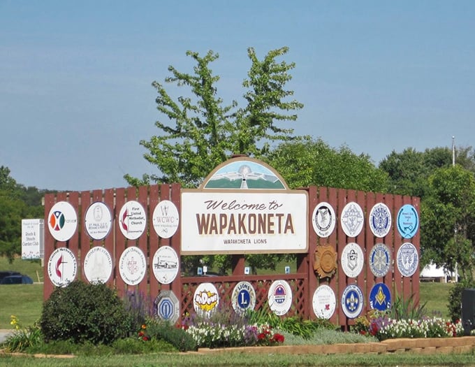 The welcome sign showcases local organizations with Midwestern pride—because in small towns, belonging to the Lions Club is still something to brag about.