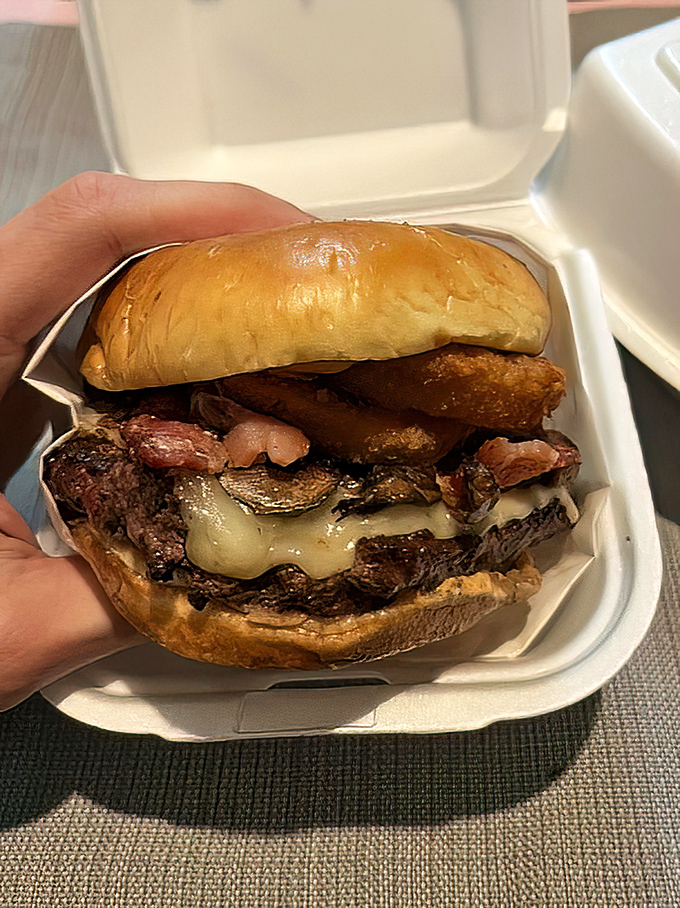 The Western Burger arrives like a cowboy riding into town—confident, no-nonsense, and ready to make an impression with its BBQ swagger.