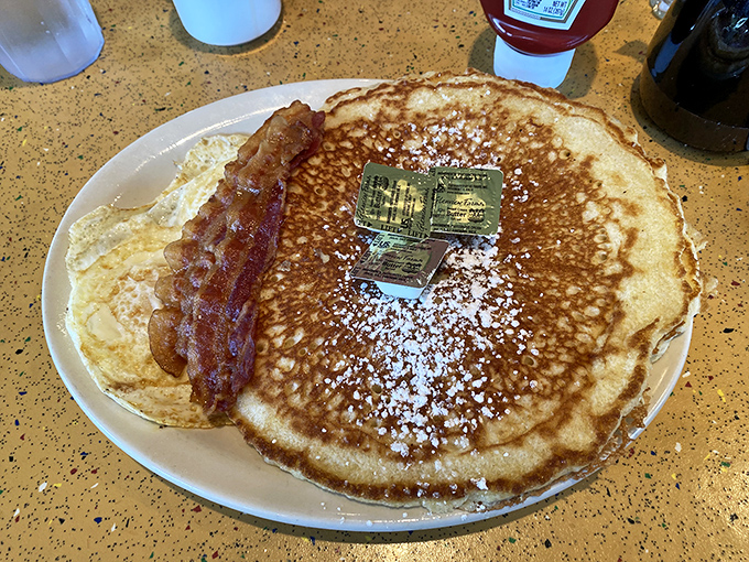 Pancakes the size of vinyl records with a side of bacon that's achieved that perfect balance between crisp and chewy—breakfast nirvana.