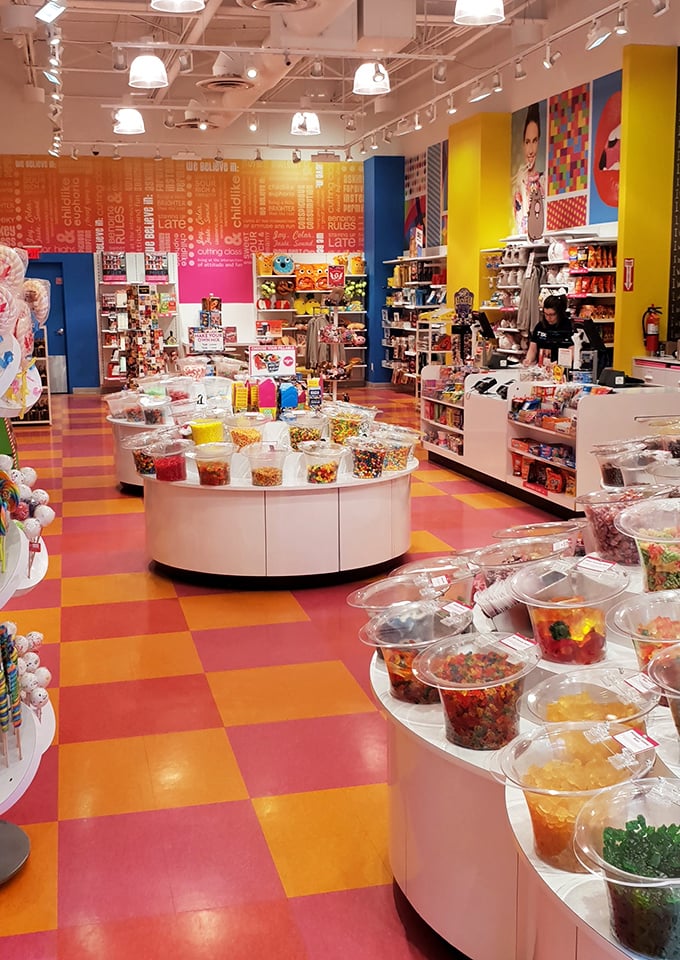 Candy wonderland where diets go to die and inner children come alive—a technicolor sugar paradise amid the shopping marathon.