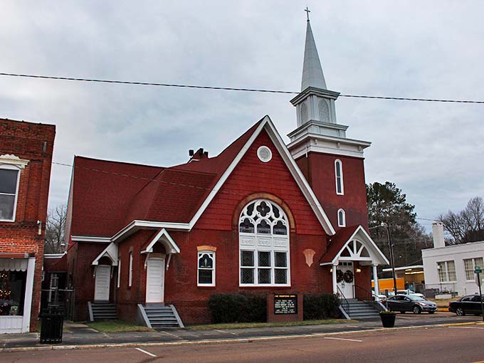 This isn't just another pretty church—it's a spiritual anchor of the community with its striking red brick and soaring steeple.