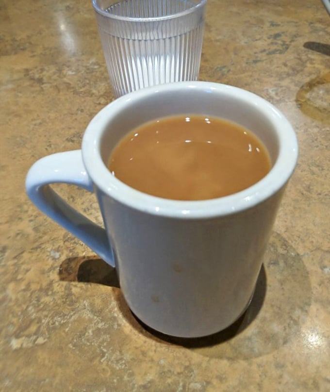Coffee in a diner mug – no foam art, no fancy bean origin story, just the kind of honest brew that's fueled American conversations for decades.