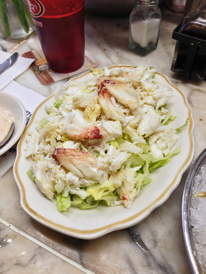 Crab salad that makes you question why anyone would ever drown seafood in mayo—this is what simplicity and respect for ingredients looks like.