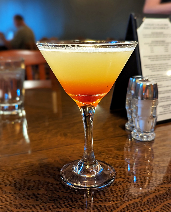 This sunset-in-a-glass cocktail doesn't just quench thirst; it starts conversations and ends workday stress with every sip.