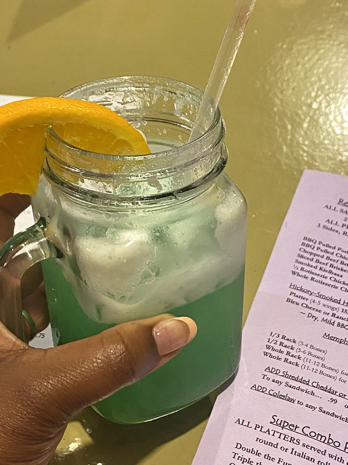 Even the drinks come with a side of Southern hospitality—this mason jar creation offers cool relief between bites of smoky, spicy goodness.