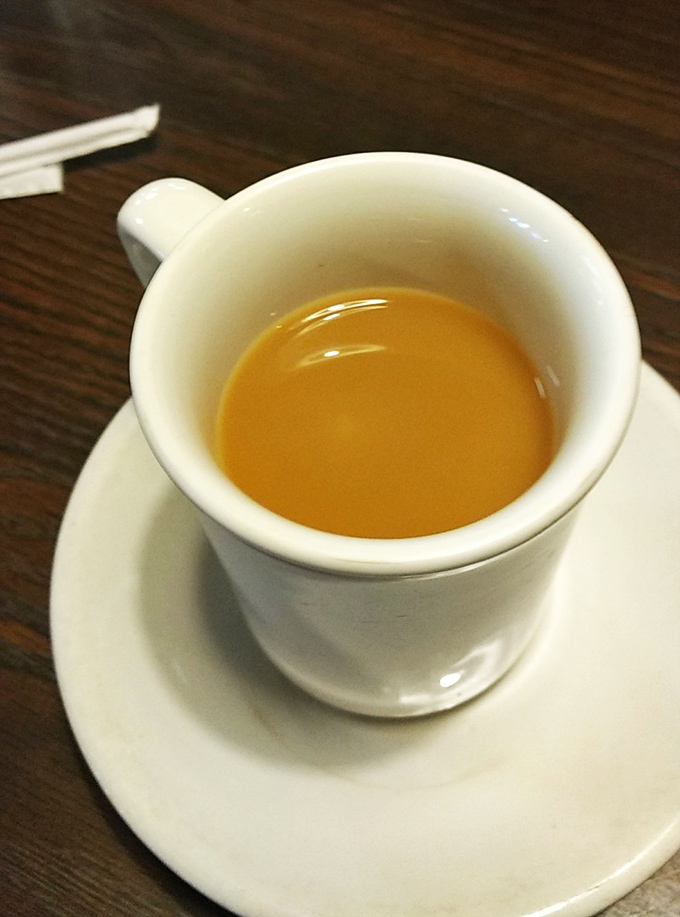 Coffee at Anna's isn't just a beverage—it's liquid motivation served in white porcelain, ready to transform zombies into functioning humans.